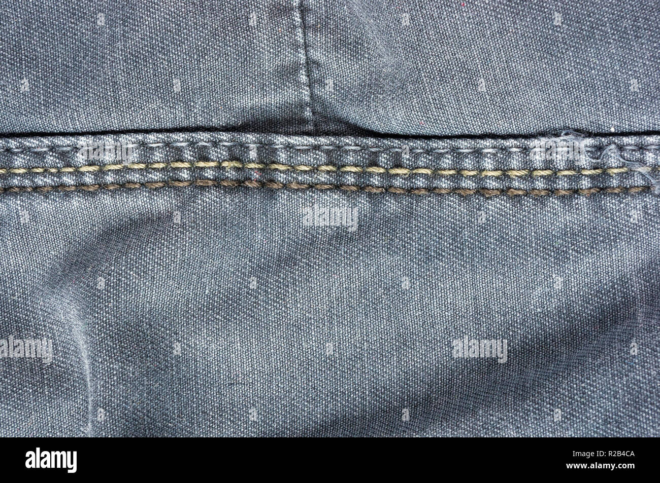 clothing items washed cotton fabric texture with seams, macro, close-up ...