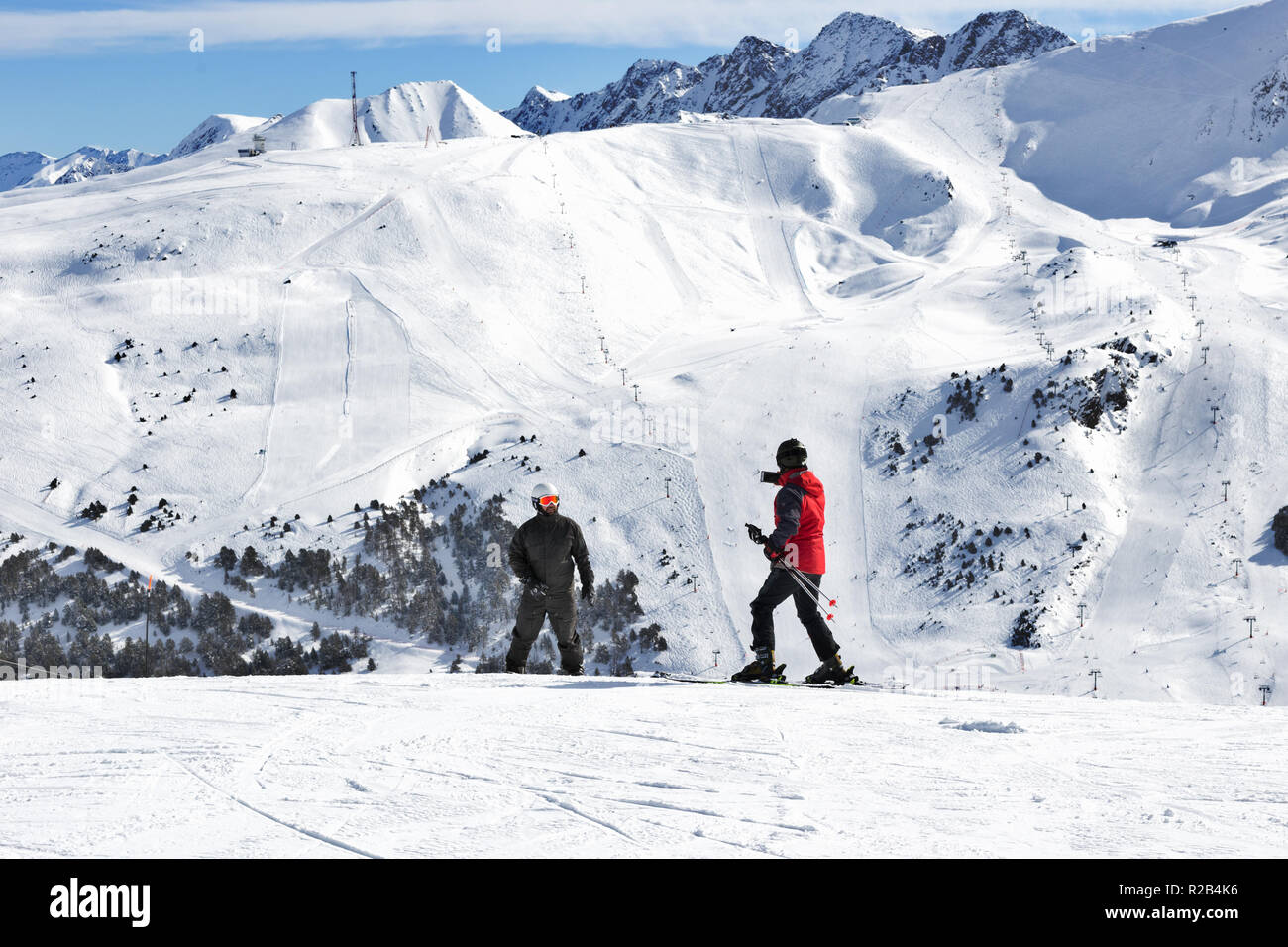 PYRENEES, ANDORRA - FEBRUARY 9, 2018: Skiers stand and look at the ...