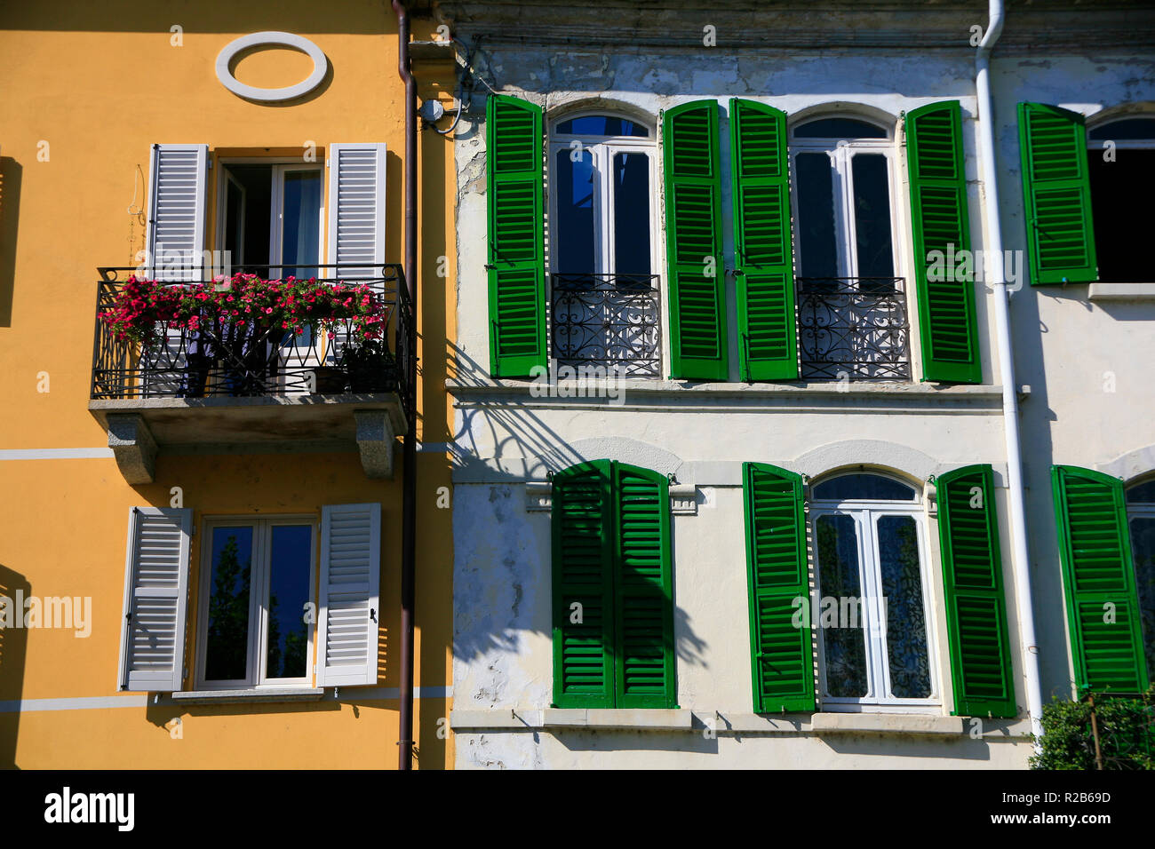 Italian townhouse facades with brightly coloured shutters Stock Photo ...