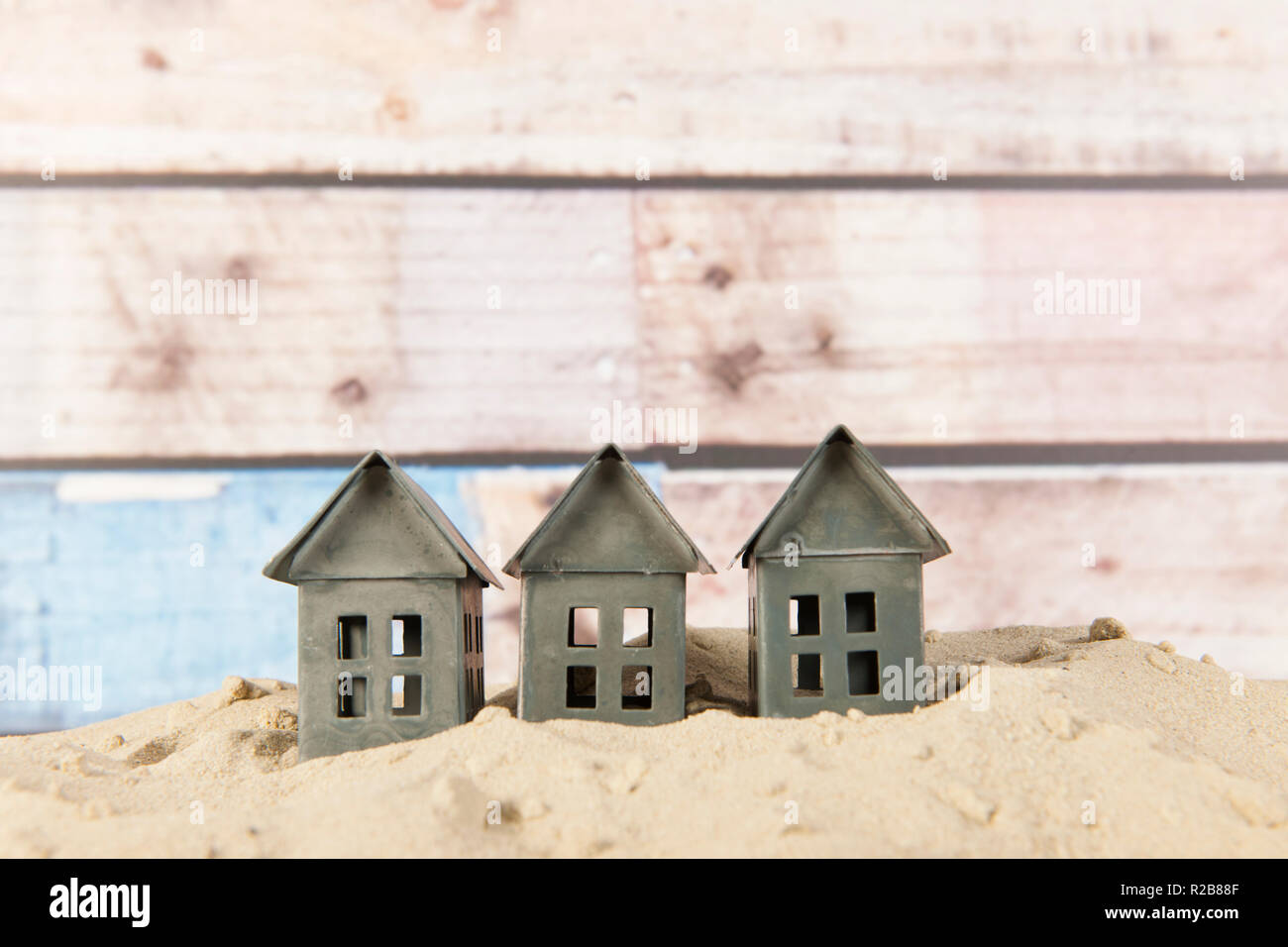Little metal houses in a row at the beach Stock Photo - Alamy