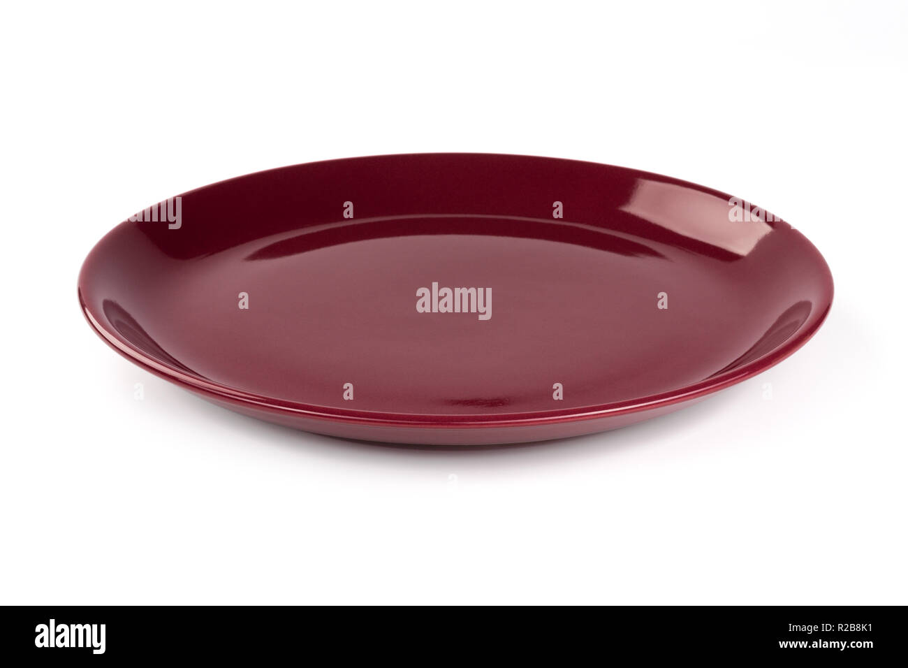 Pastel wine red colored plate isolated on white background, front view ...