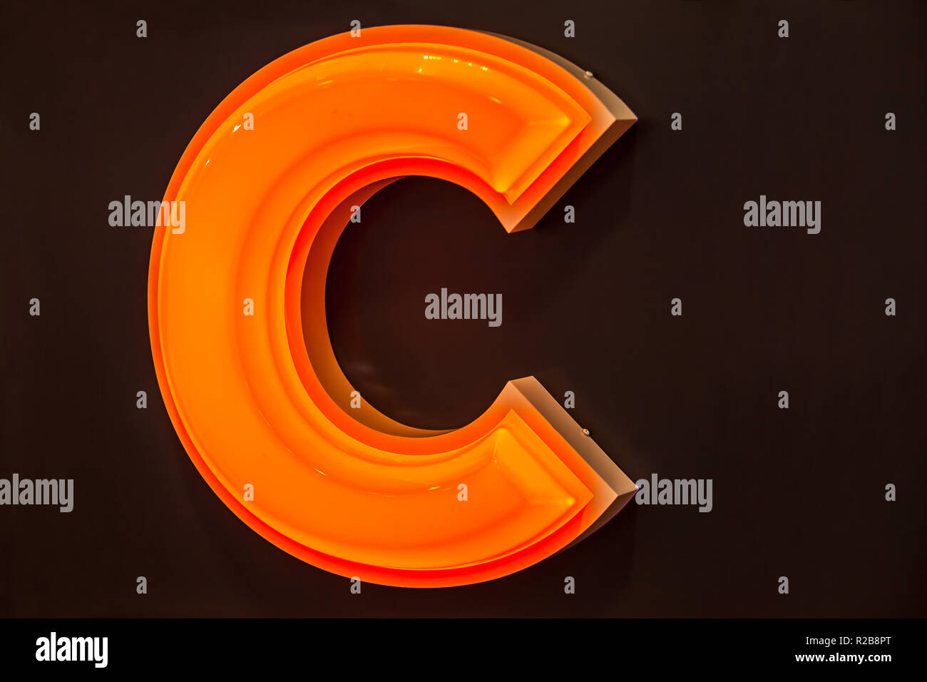 The letter C as a sign object over dark background Stock Photo - Alamy