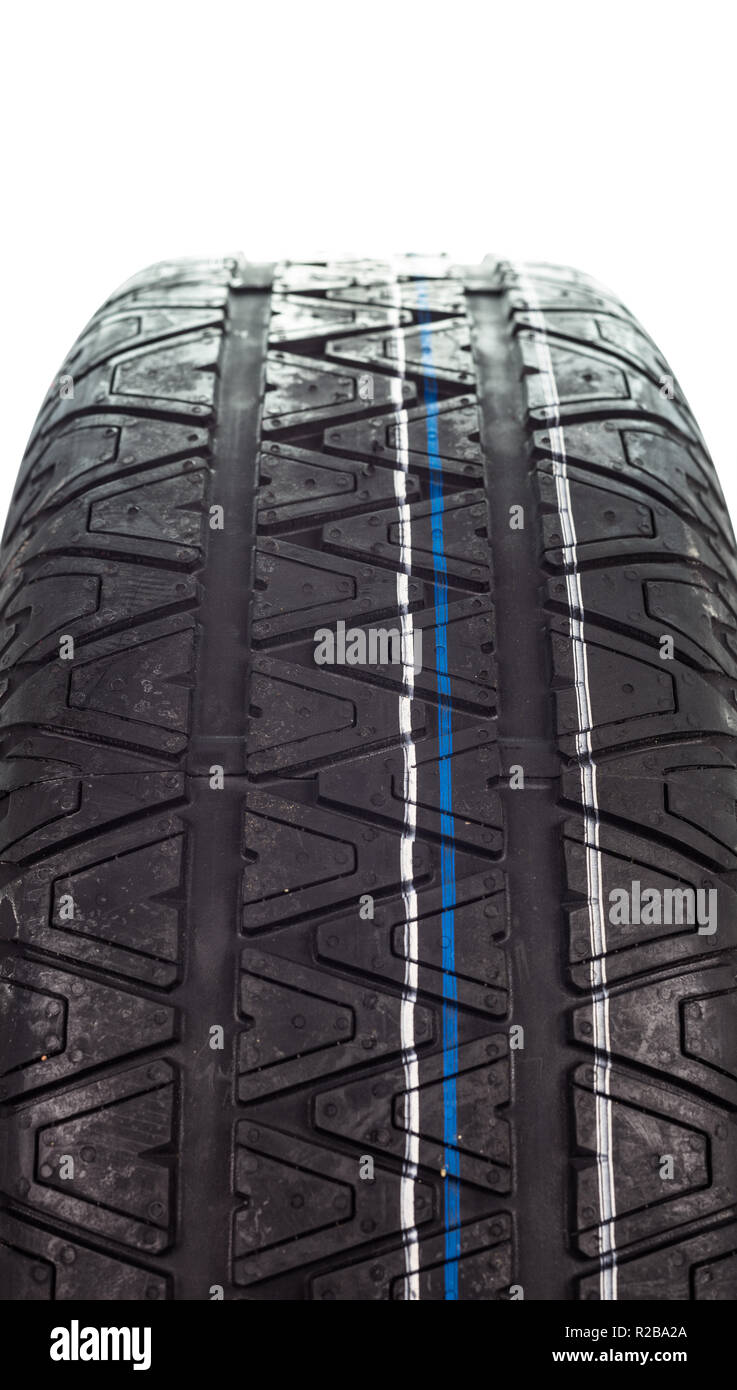 The surface of a new car tire close up, isolated on a white background ...