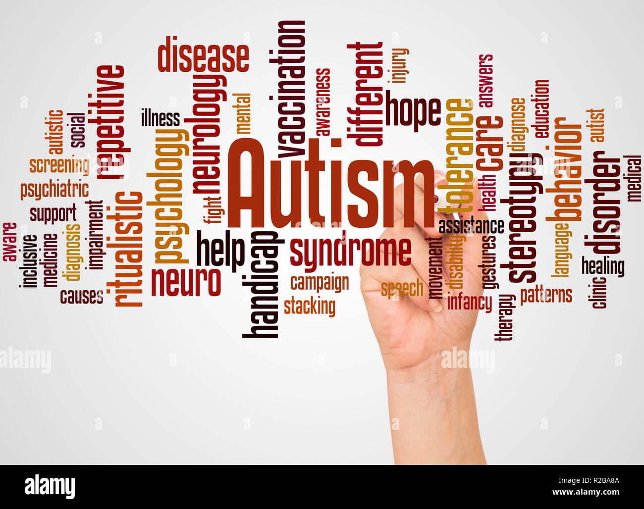 Autism word cloud and hand with marker concept on white background ...