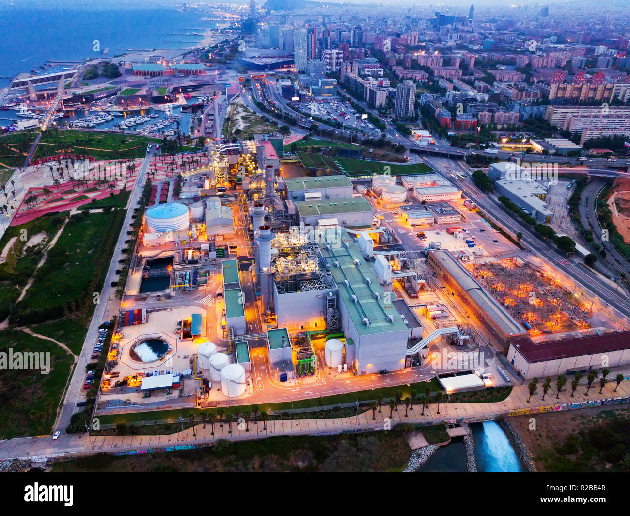 Aerial night view of power plant and waste treatment plant in Barcelona ...