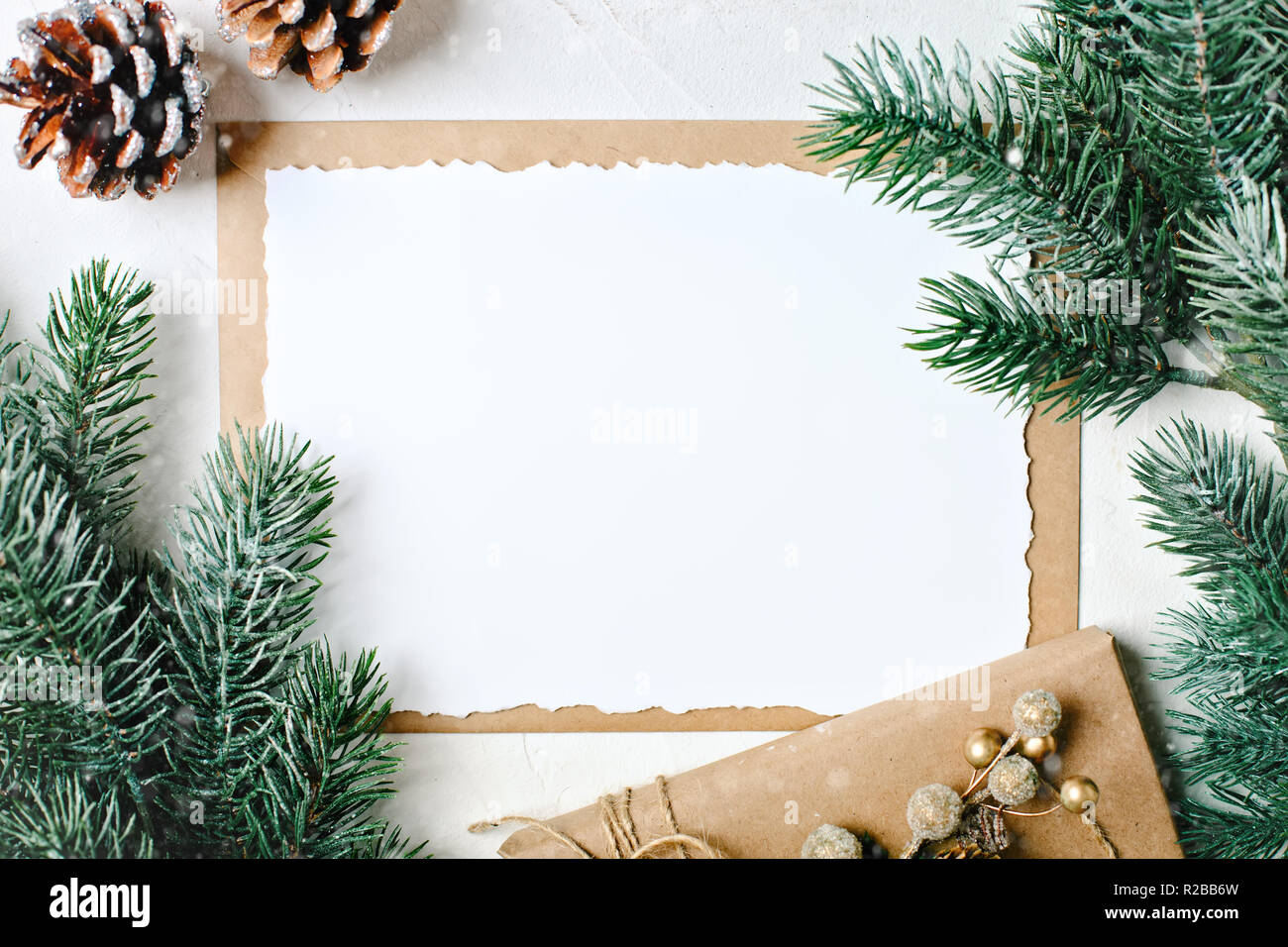 Merry Christmas and happy New year. Mockup with postcard and branches ...