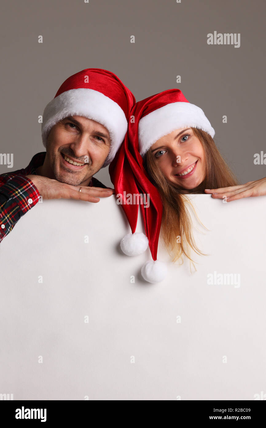 Men in santa hats holding hi-res stock photography and images - Alamy