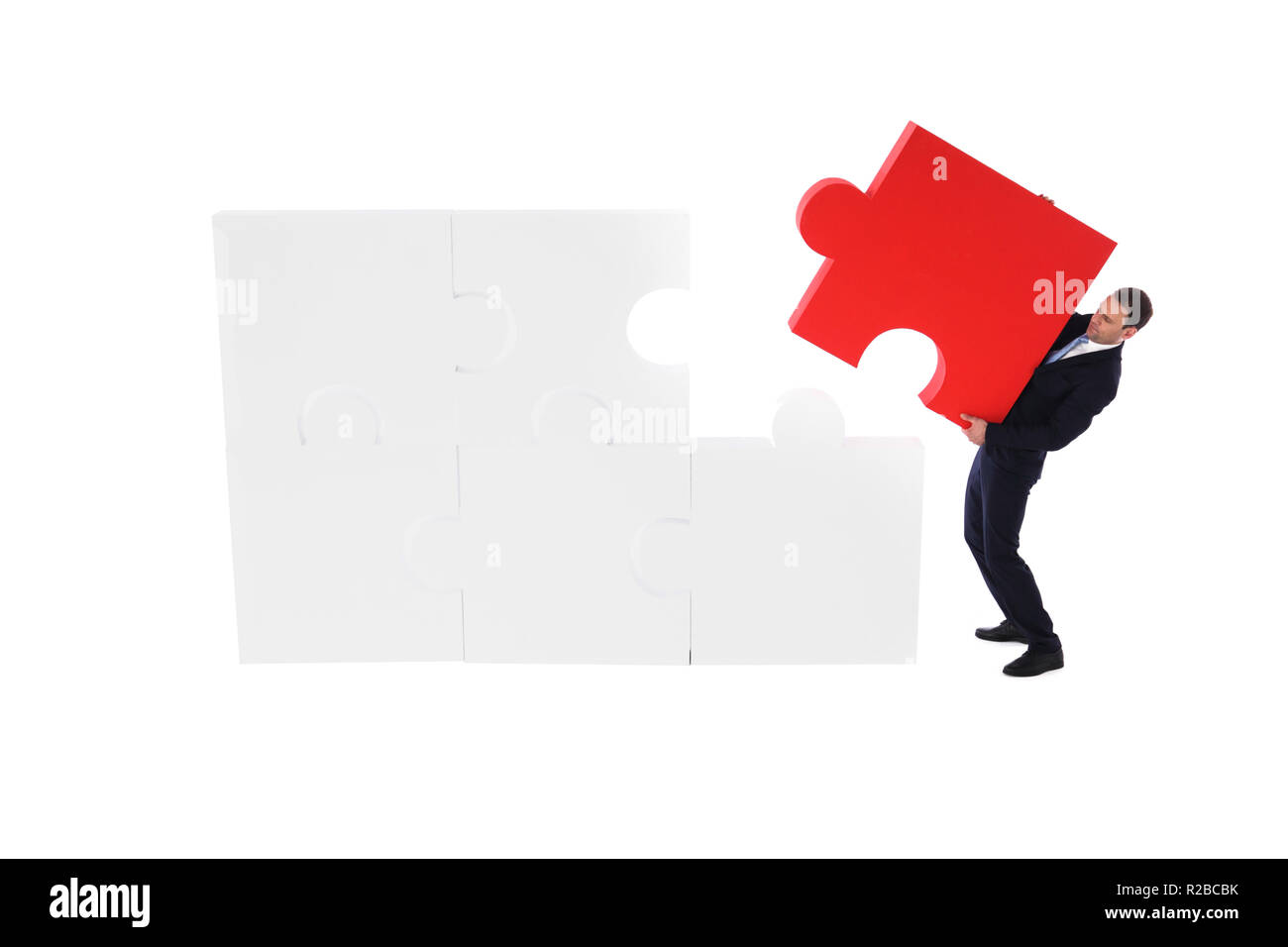 Man pushing puzzle piece hi-res stock photography and images - Alamy