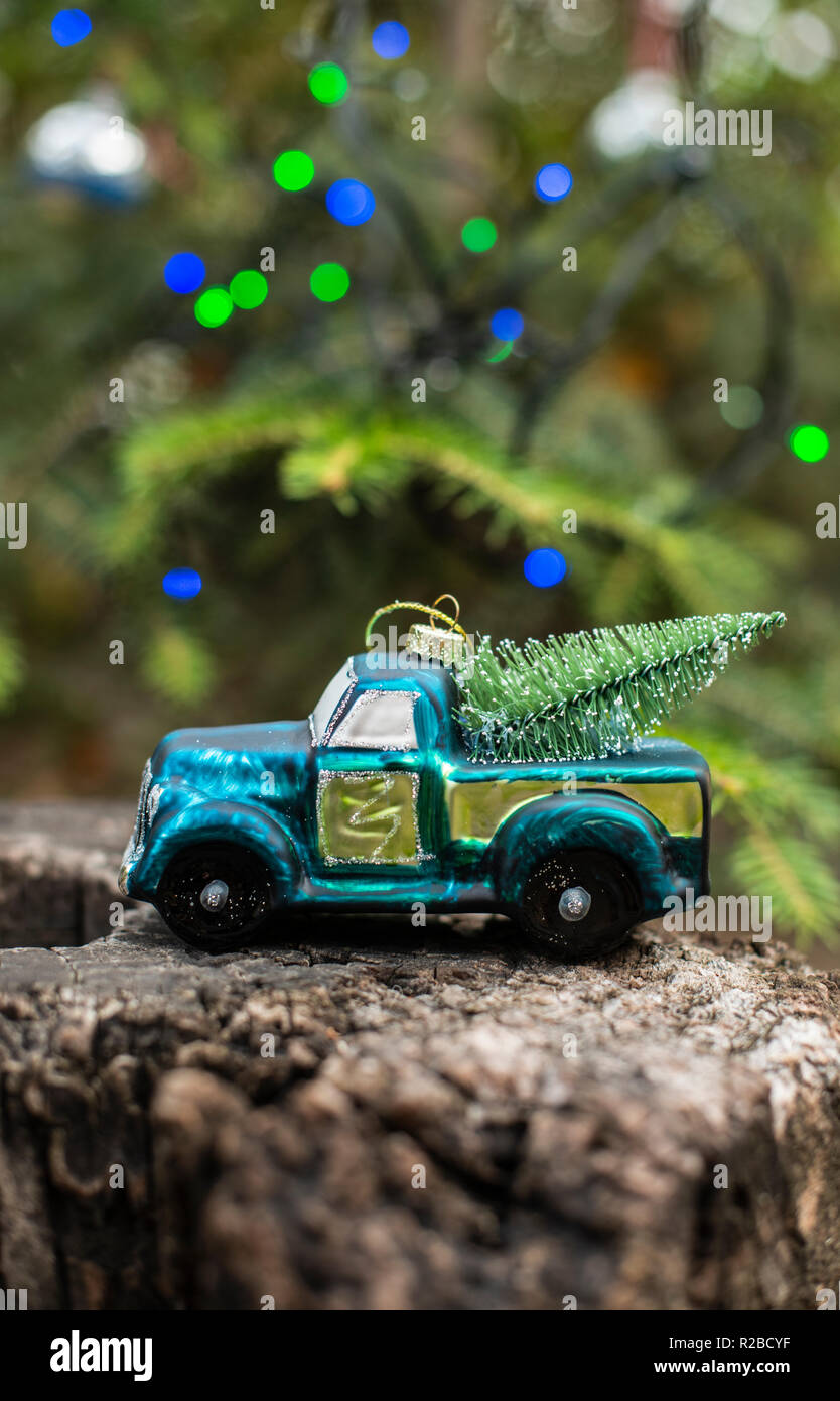 Car with christmas tree on stump Stock Photo - Alamy