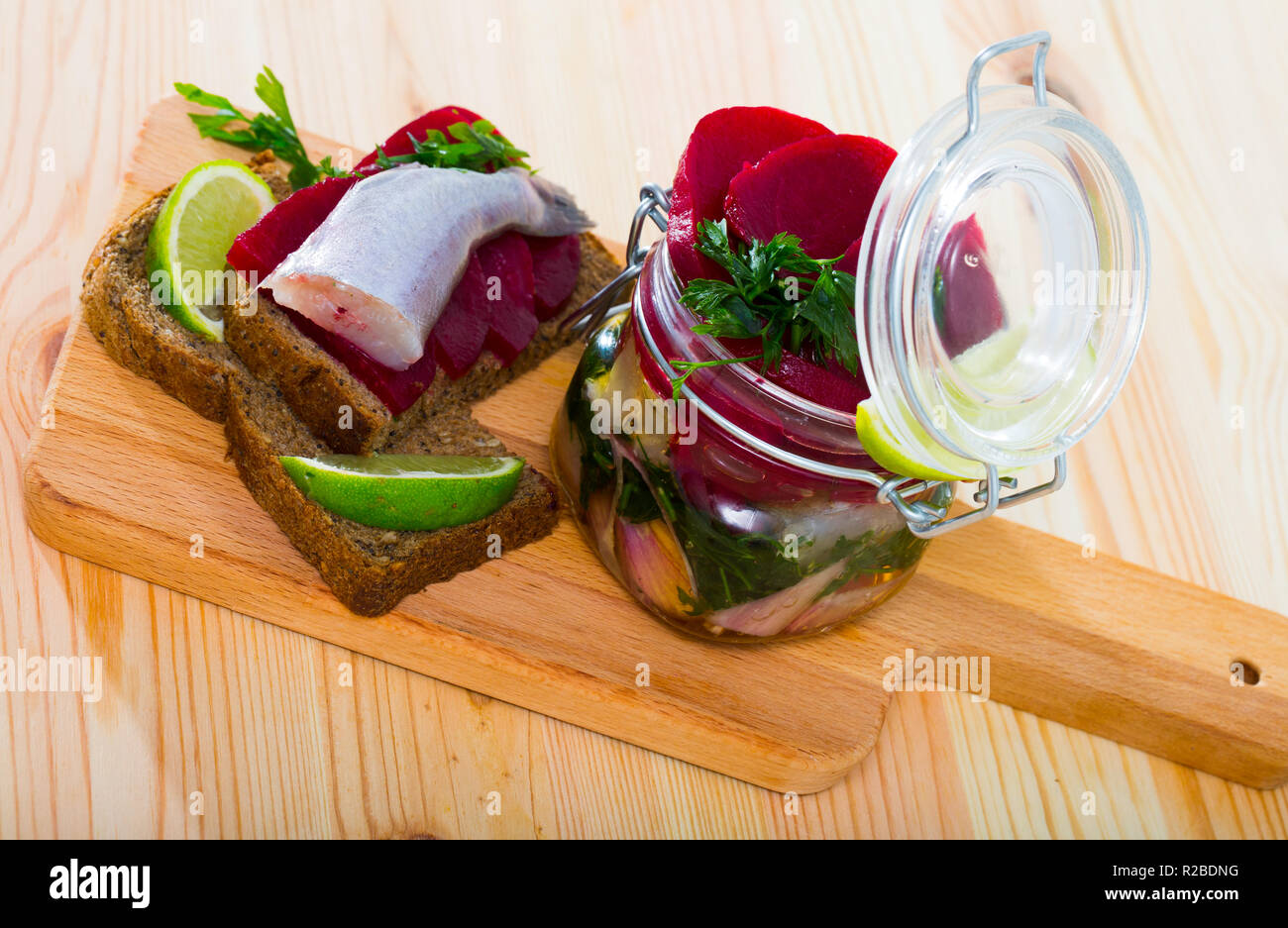 Homemade pickled blue whiting fish onions, beets and marinade of lime ...