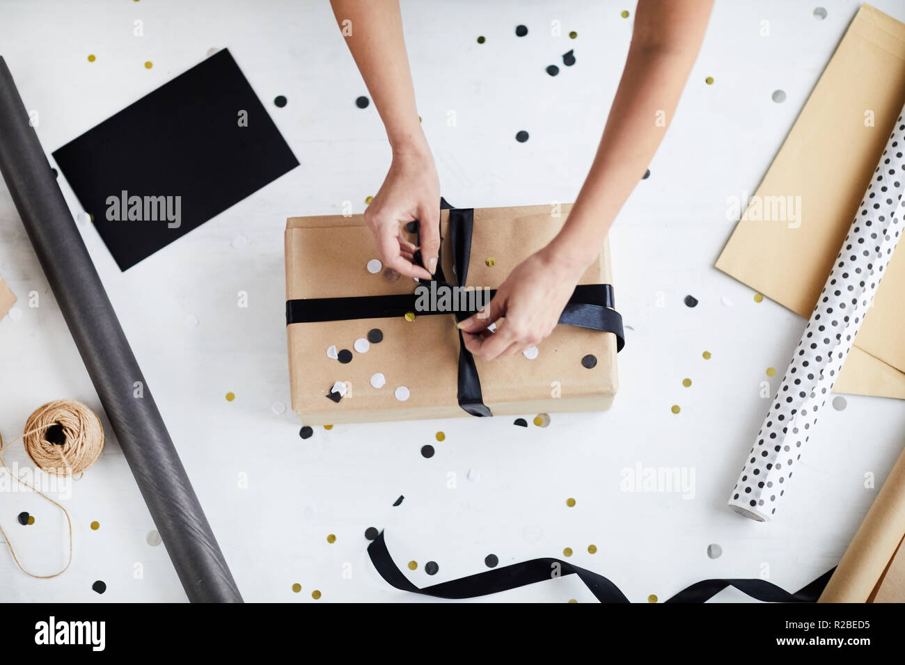Woman Wrapping Present Stock Photo - Alamy