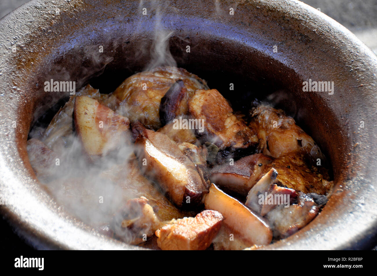 meat cooked according to old recipes in a cast-iron cauldron Stock ...