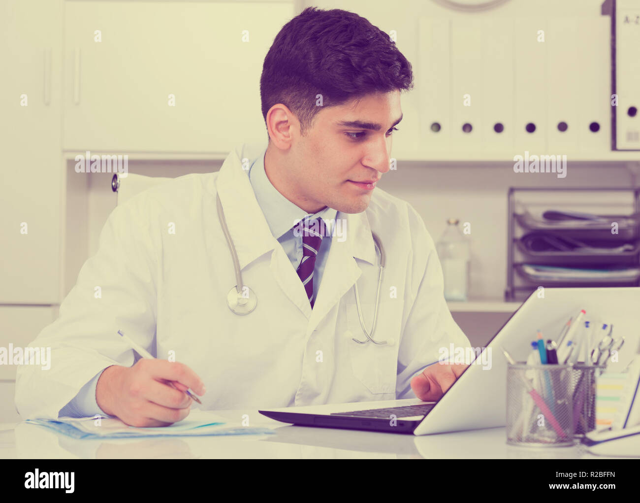Young therapist doing report hi-res stock photography and images - Alamy