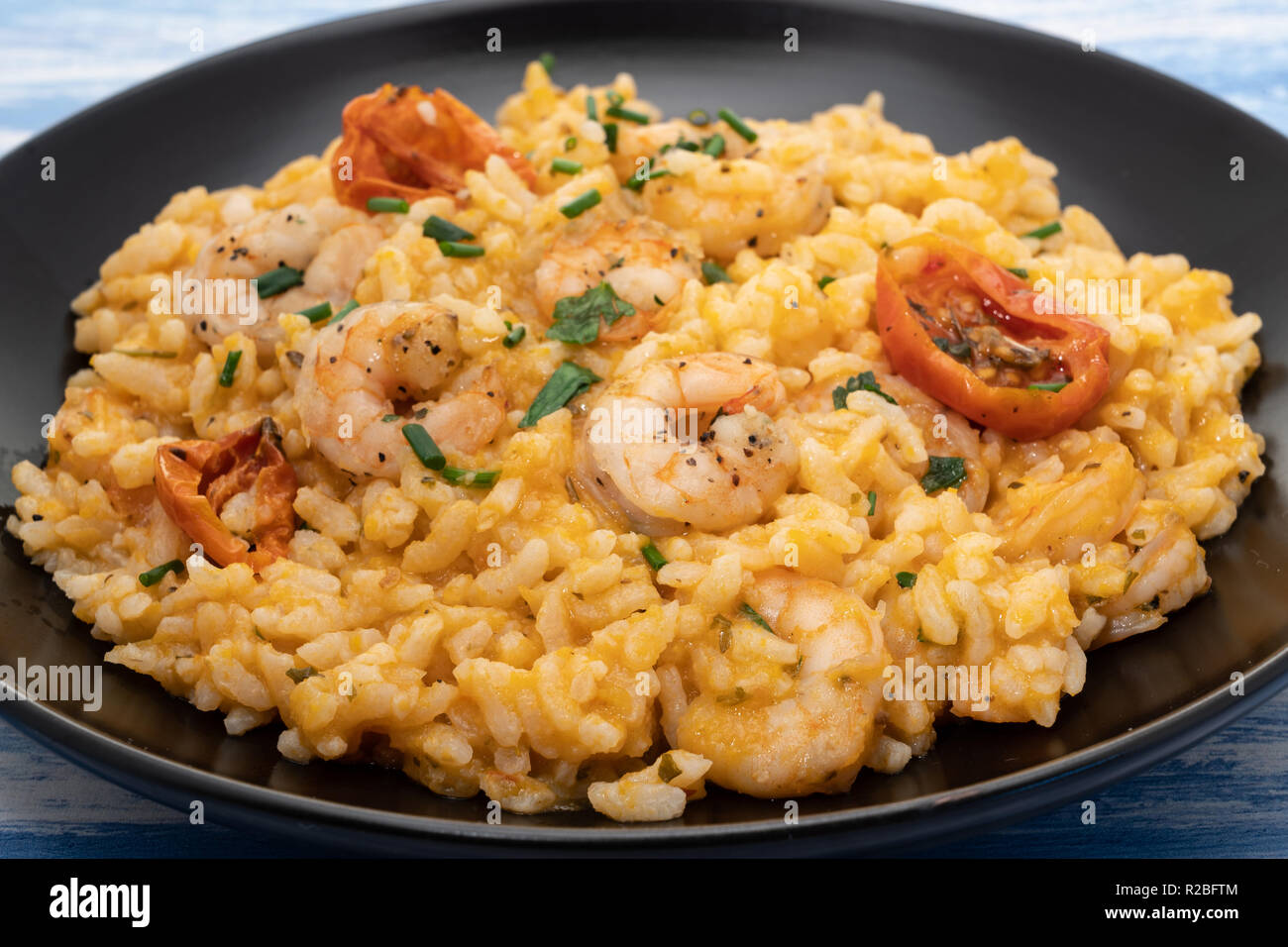 A serving of king prawn risotto Stock Photo - Alamy