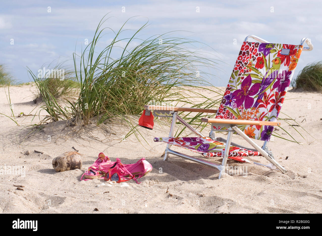 Colorful Beach Chair in a Florida Sand Dune Stock Photo - Alamy