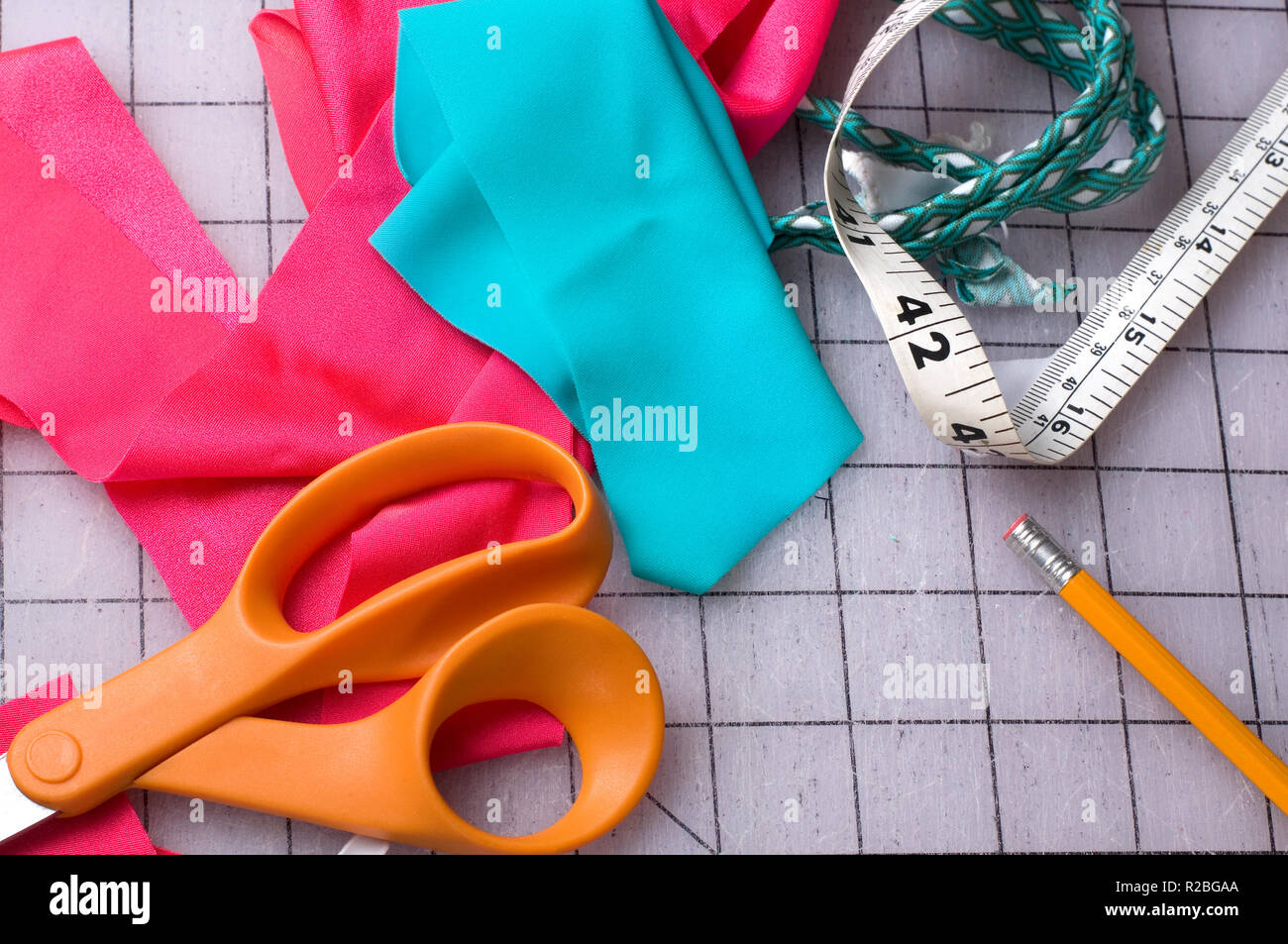 Tools used by a Seamstress or Tailor with Colorful Textiles Stock Photo ...