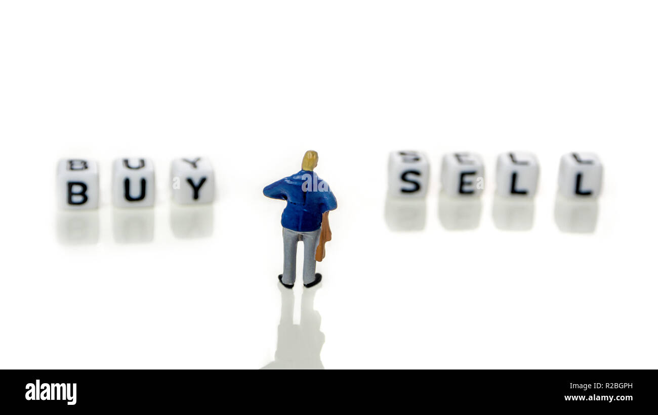 closeup of miniature figurines of businessman standing in front of ...