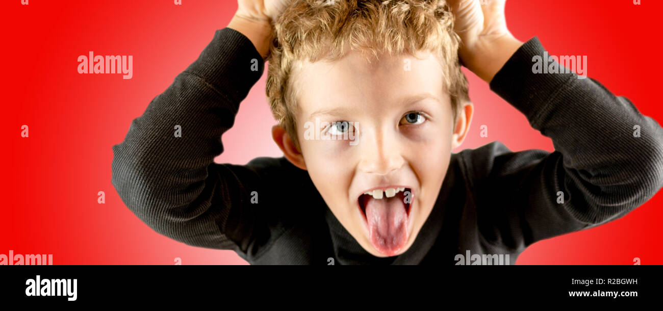 closeup of young boy heavy screaming expression with crazy look and ...