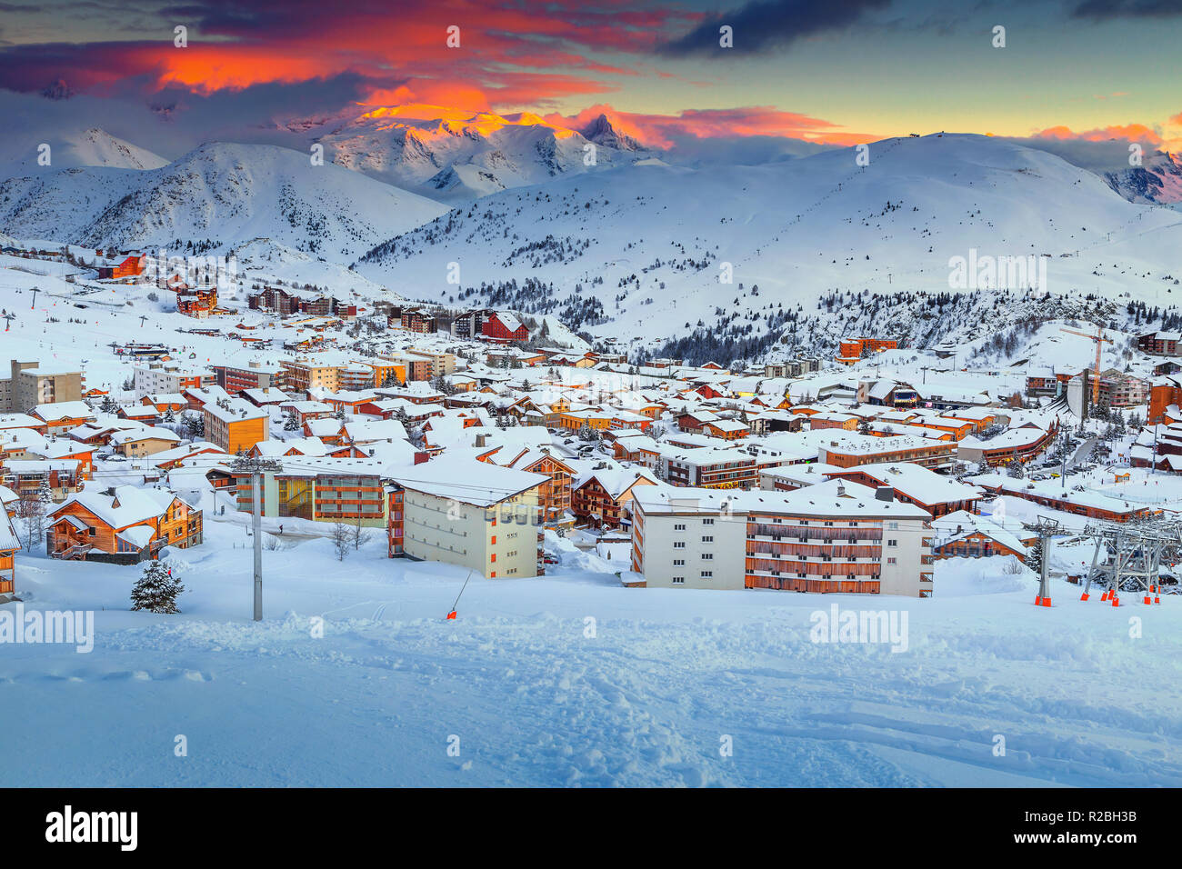 Breathtaking colorful winter sunset landscape, famous ski resort with ...