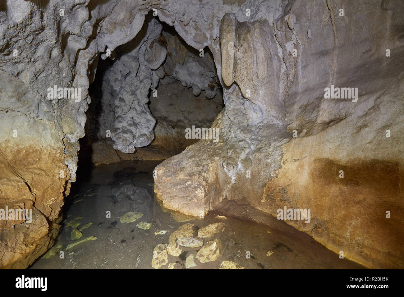 Cave with a lake inside and various speleothemes Stock Photo - Alamy