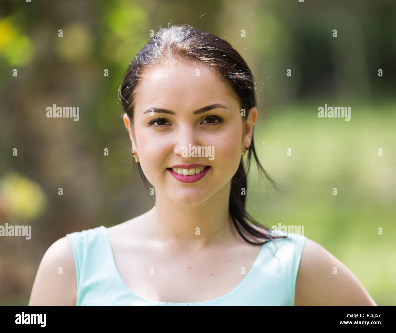 sunny cheerful positive young spanish woman portrait in outdoors Stock ...