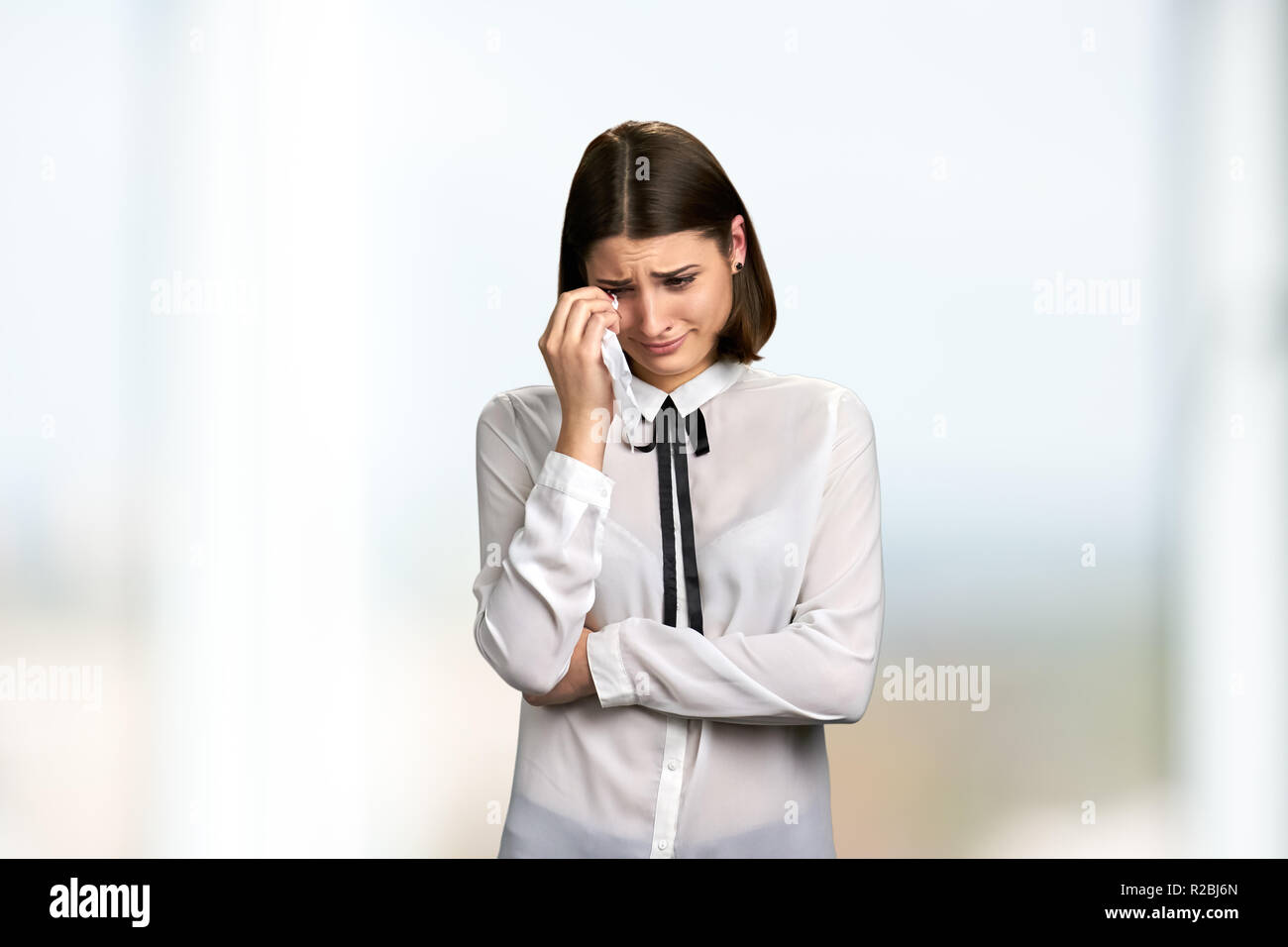 Young pretty brunette is crying. Beautiful young woman is crying and ...