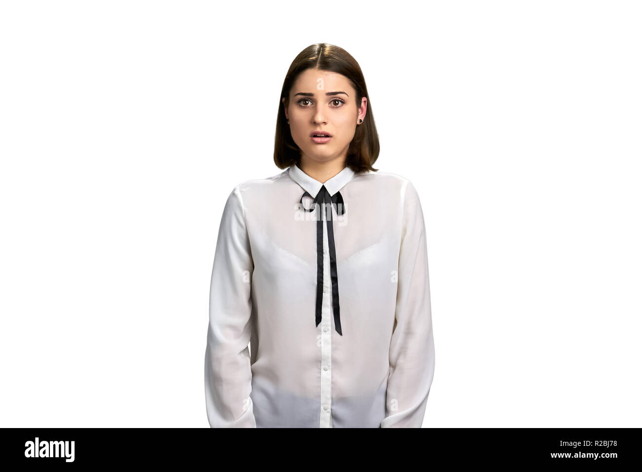 Portrait of young shocked business lady. Pretty confused woman with ...