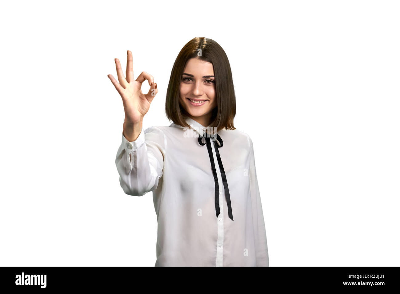 Portrait of woman showing ok sign. Pretty smiling business woman ...