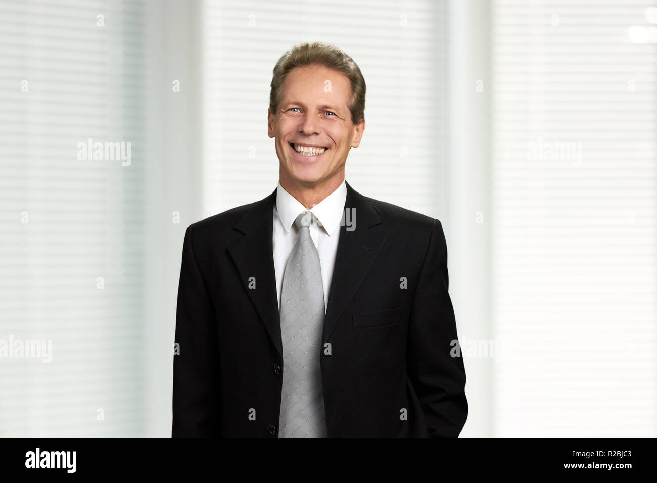Portrait of excited mature businessman. Caucasian male entrepreneur ...