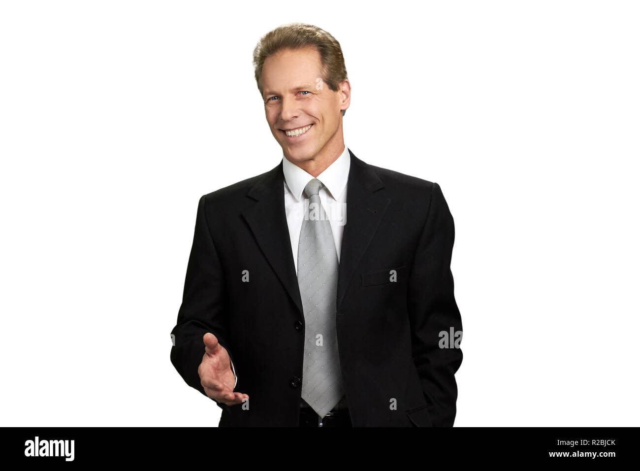 Portrait of friendly businessman with arm out. Handsome businessman ...