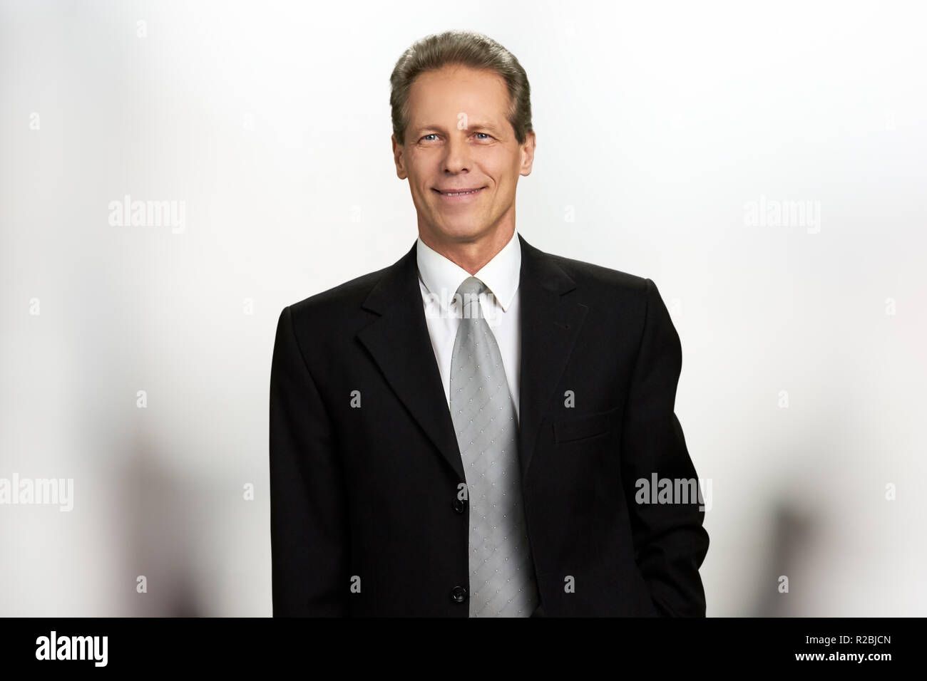 Portrait of cheerful mature businessman. Middle-aged man in black ...