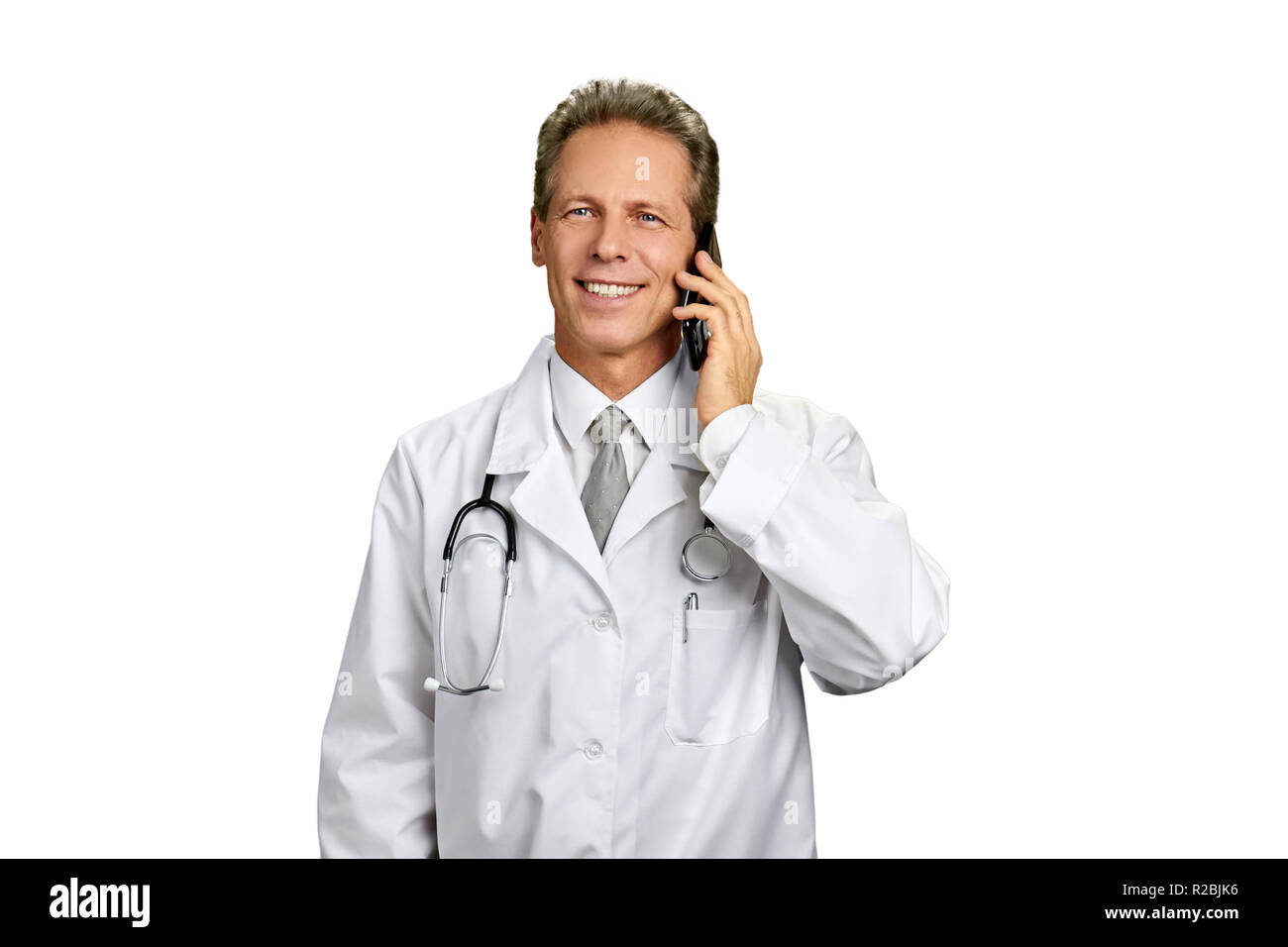 Portrait of successful doctor talking on phone. Smiling medical doctor ...