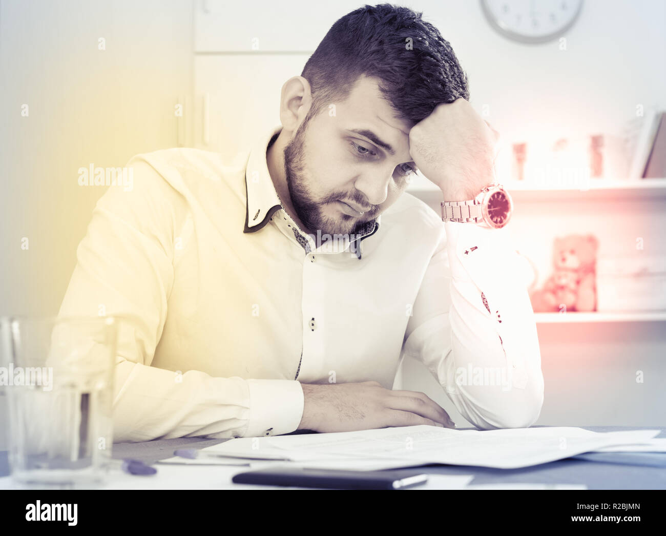 Young angry male worker having problem in project in office Stock Photo ...