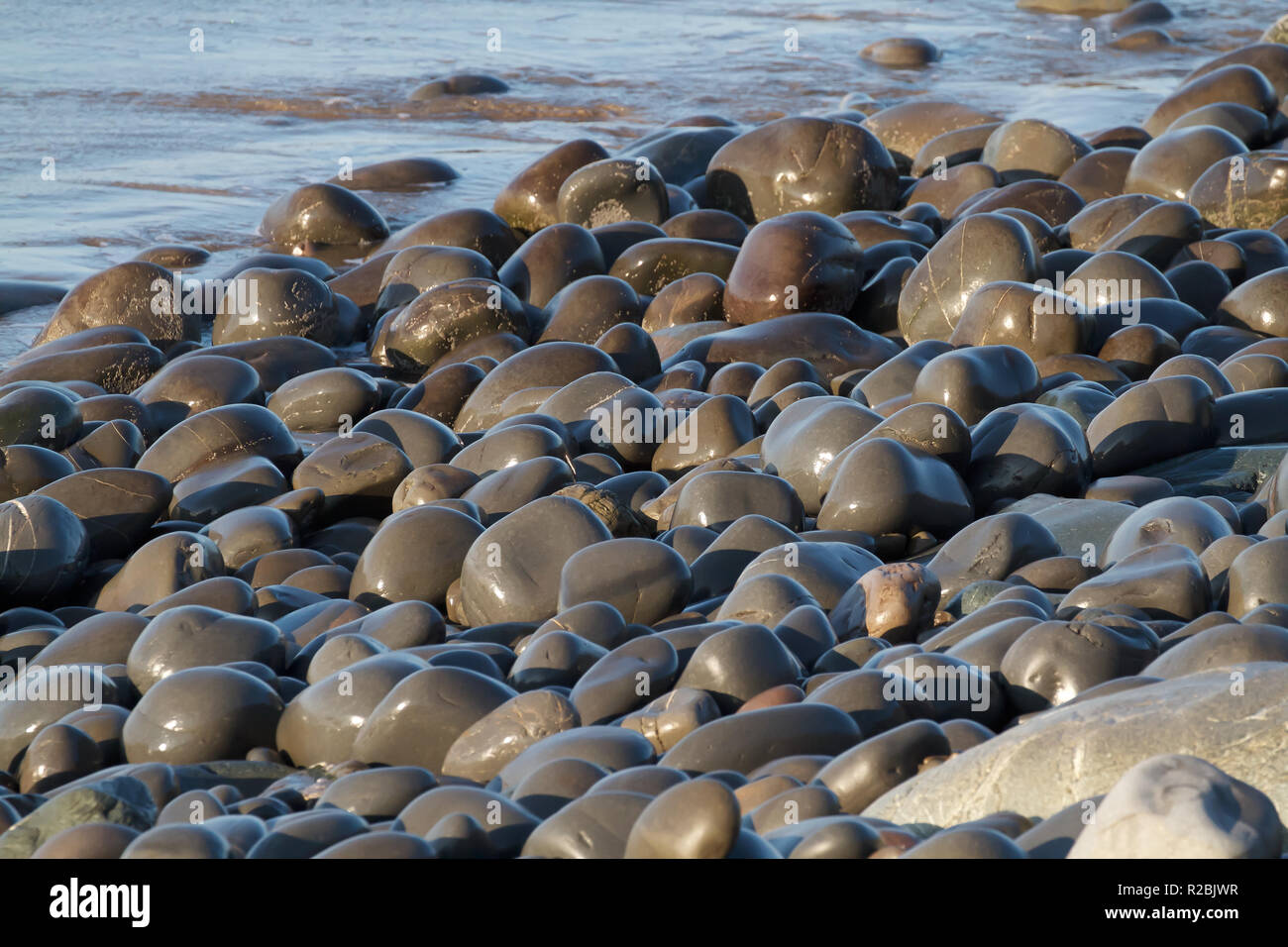 Large grey stone pebbles on Westward Ho! beach in Devon Stock Photo - Alamy