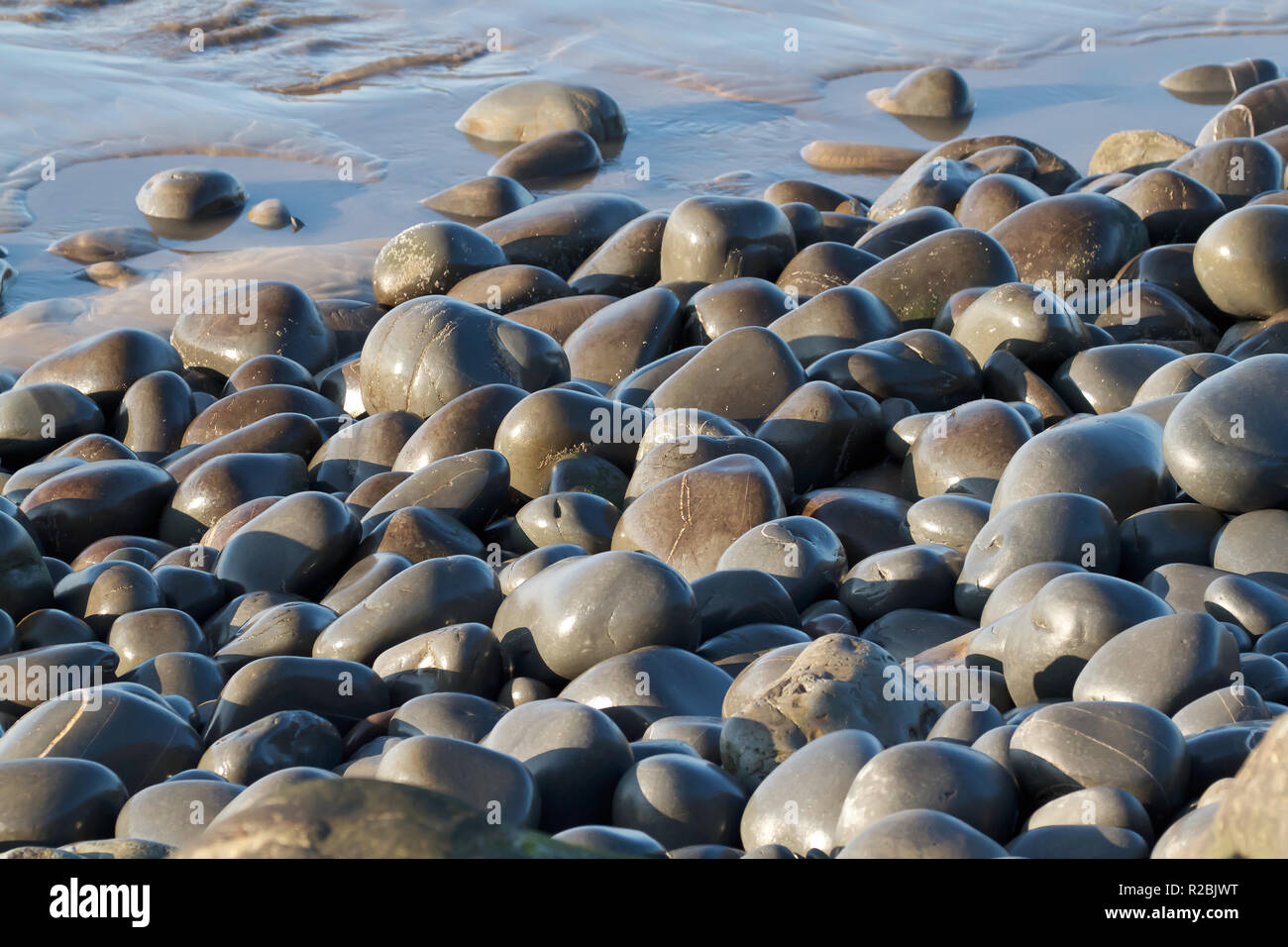 Large grey stone pebbles on Westward Ho! beach in Devon Stock Photo - Alamy