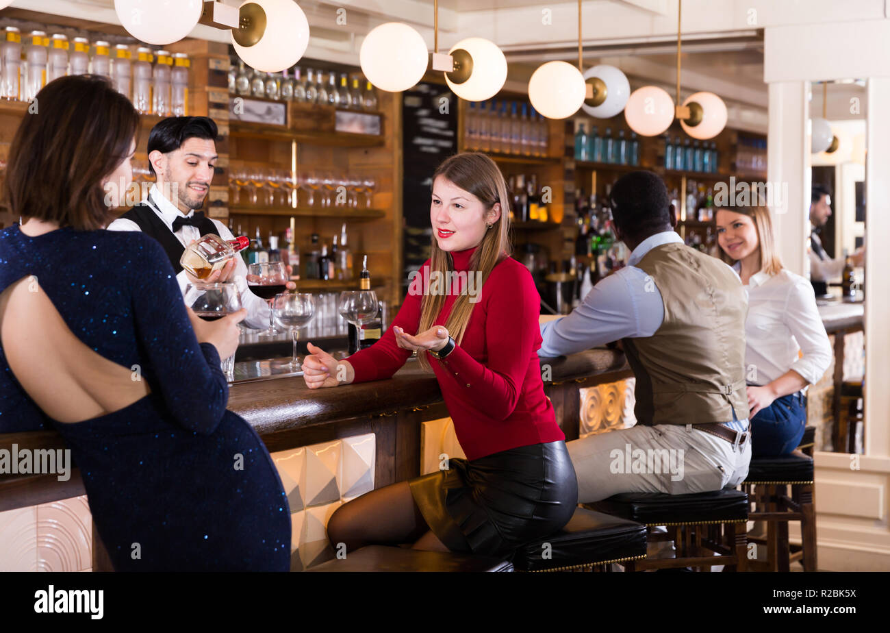 Bar party people drinking at restaurant bar counter hi-res stock ...