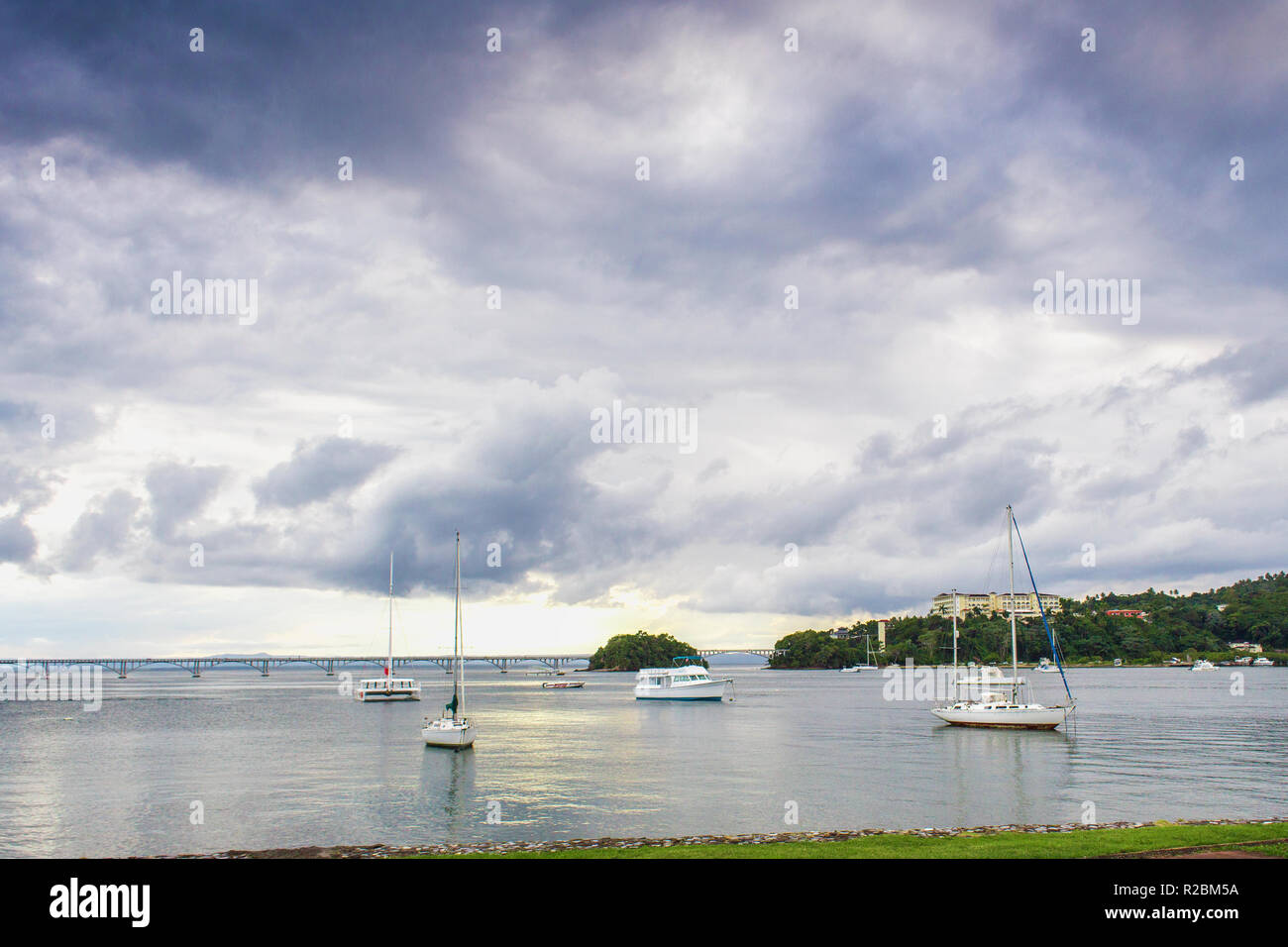 sail boats near the cost with palm trees in cloudy weather. Samana ...