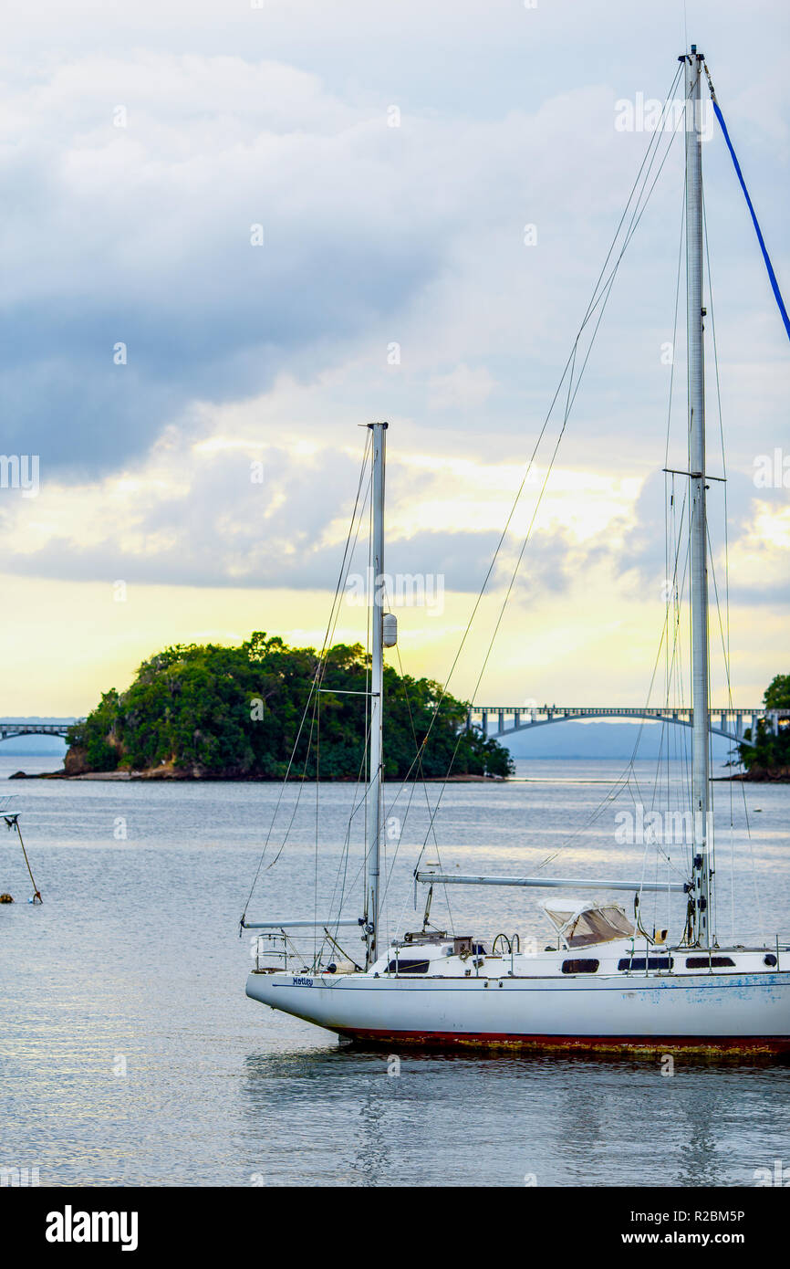 small sailing boat near the cost Stock Photo - Alamy