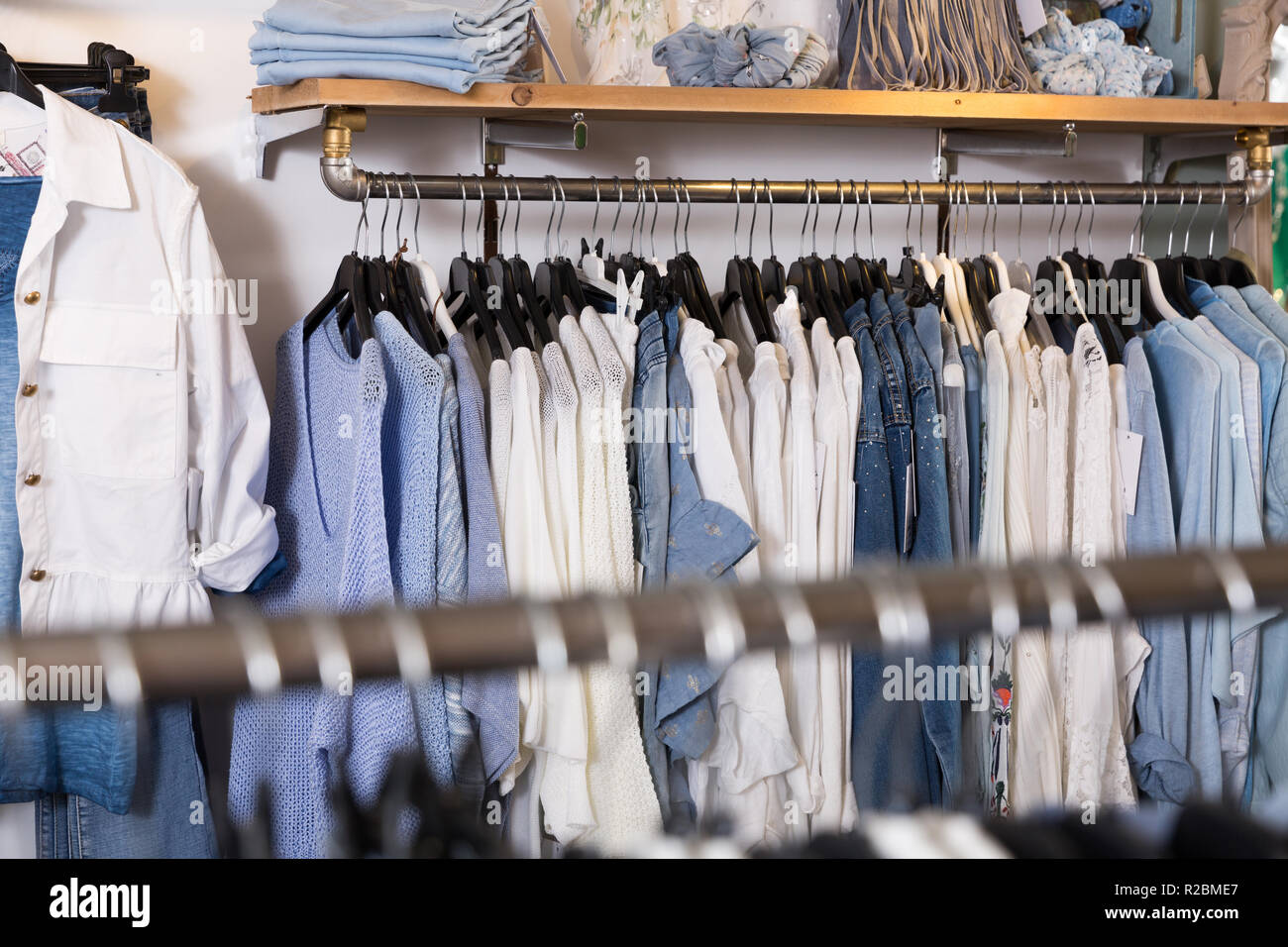 Different assortment of colorful clothing in the modern boutique Stock ...