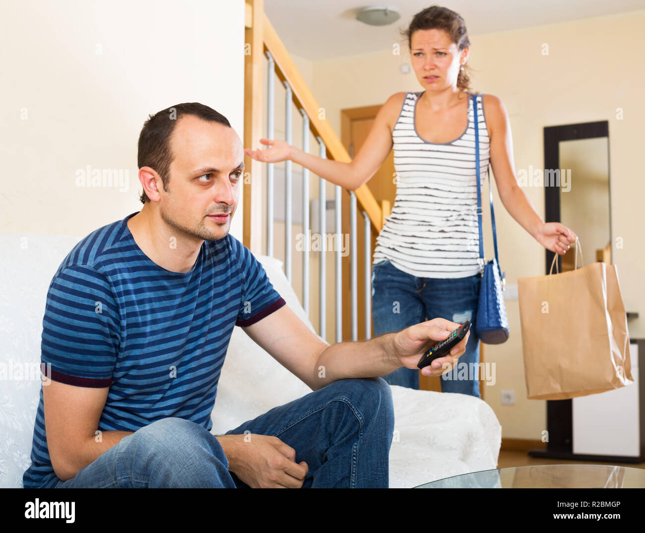 Family couple having the serious conversation in home Stock Photo - Alamy