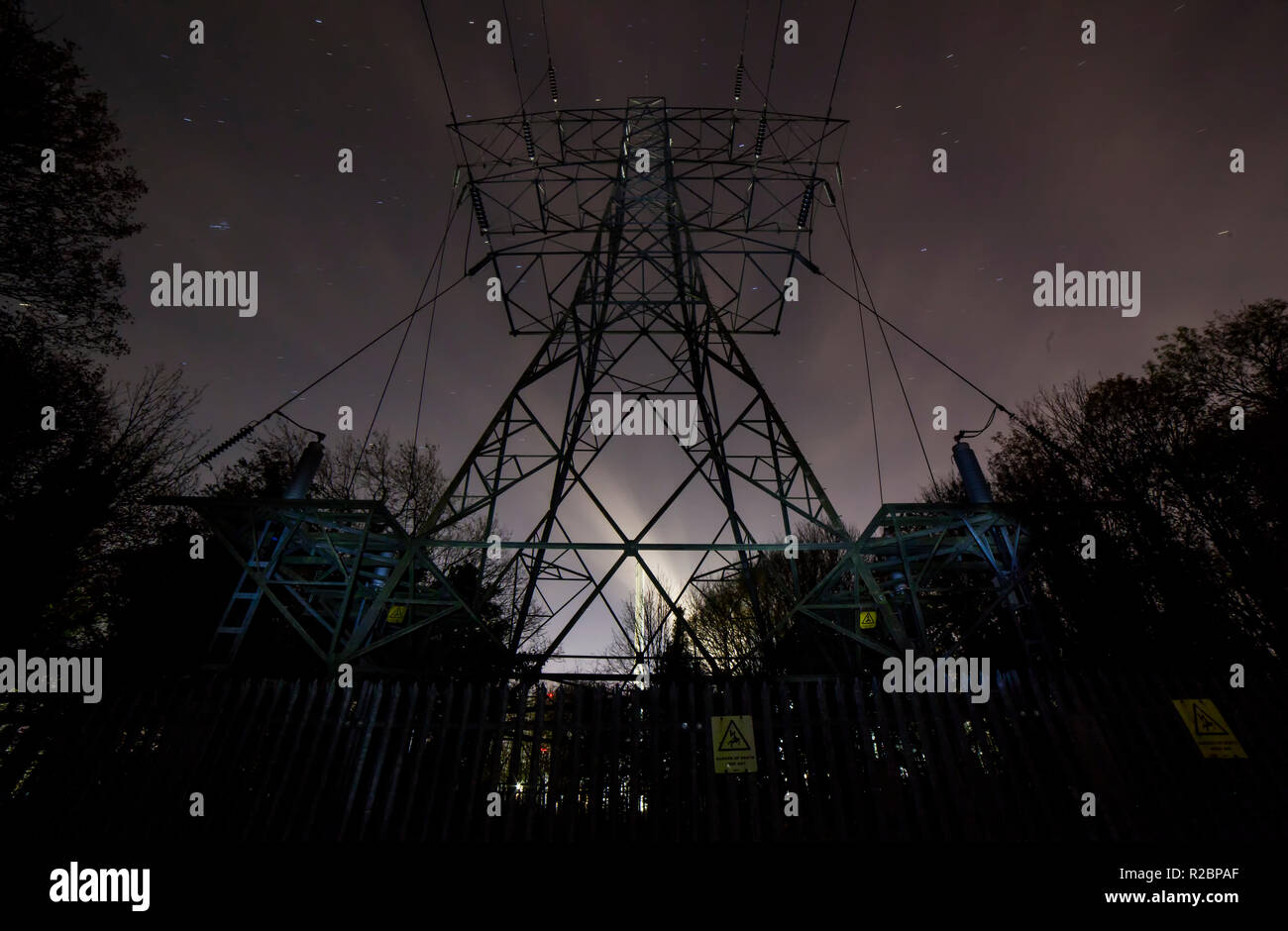 electrical pylon on a starry night Stock Photo - Alamy