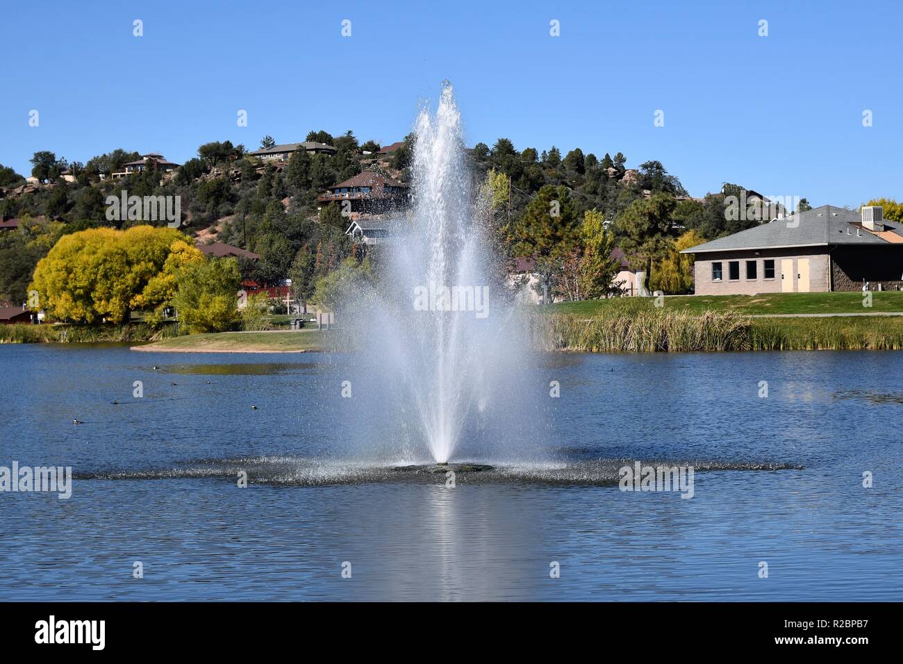 Fountain in lake at city park in Payson Arizona Stock Photo - Alamy