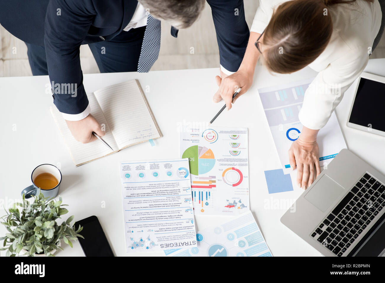 Businessman examining graph report hi-res stock photography and images ...