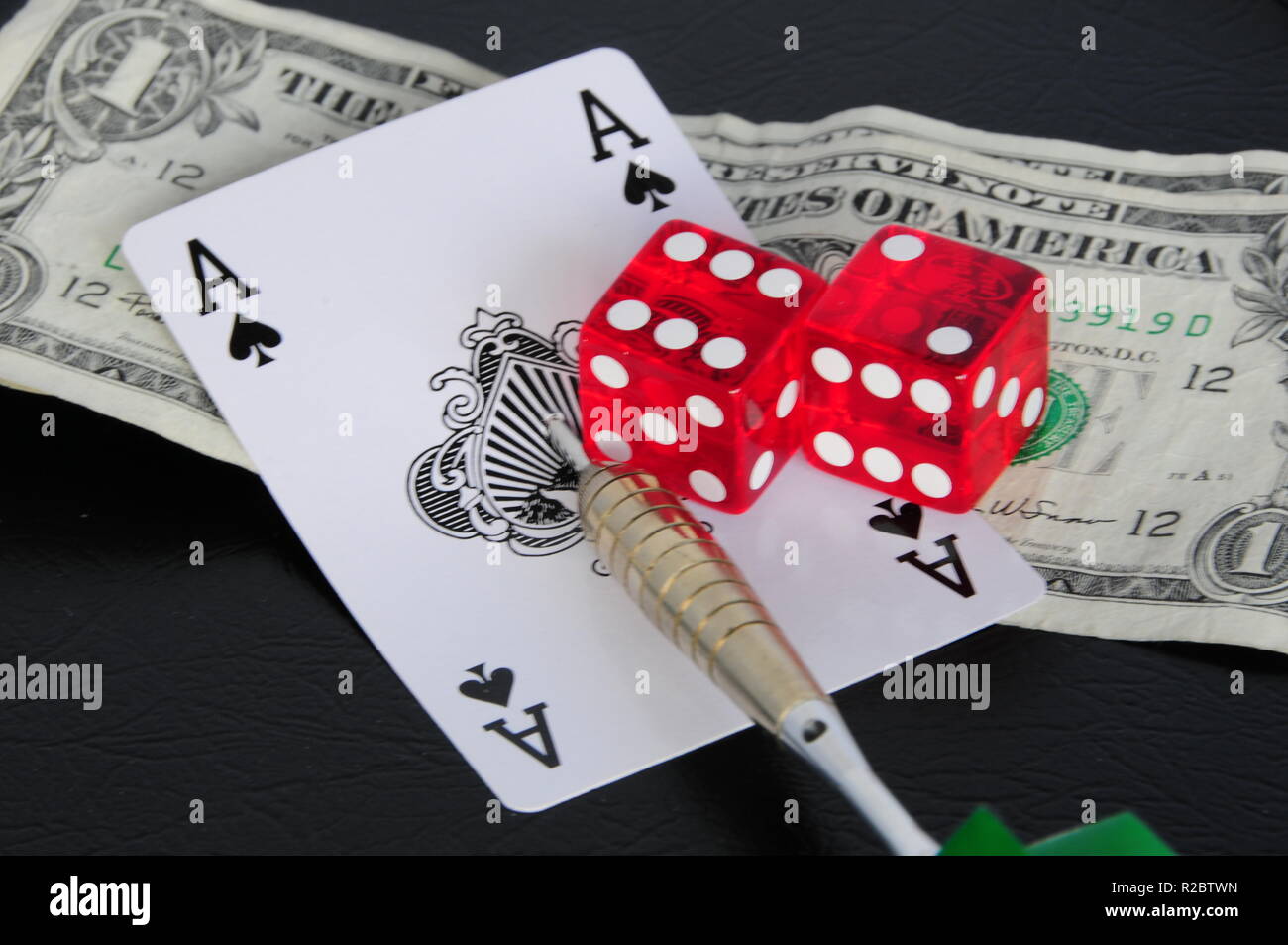 Gambling addiction - playing card with litters and dart dice and dollar ...