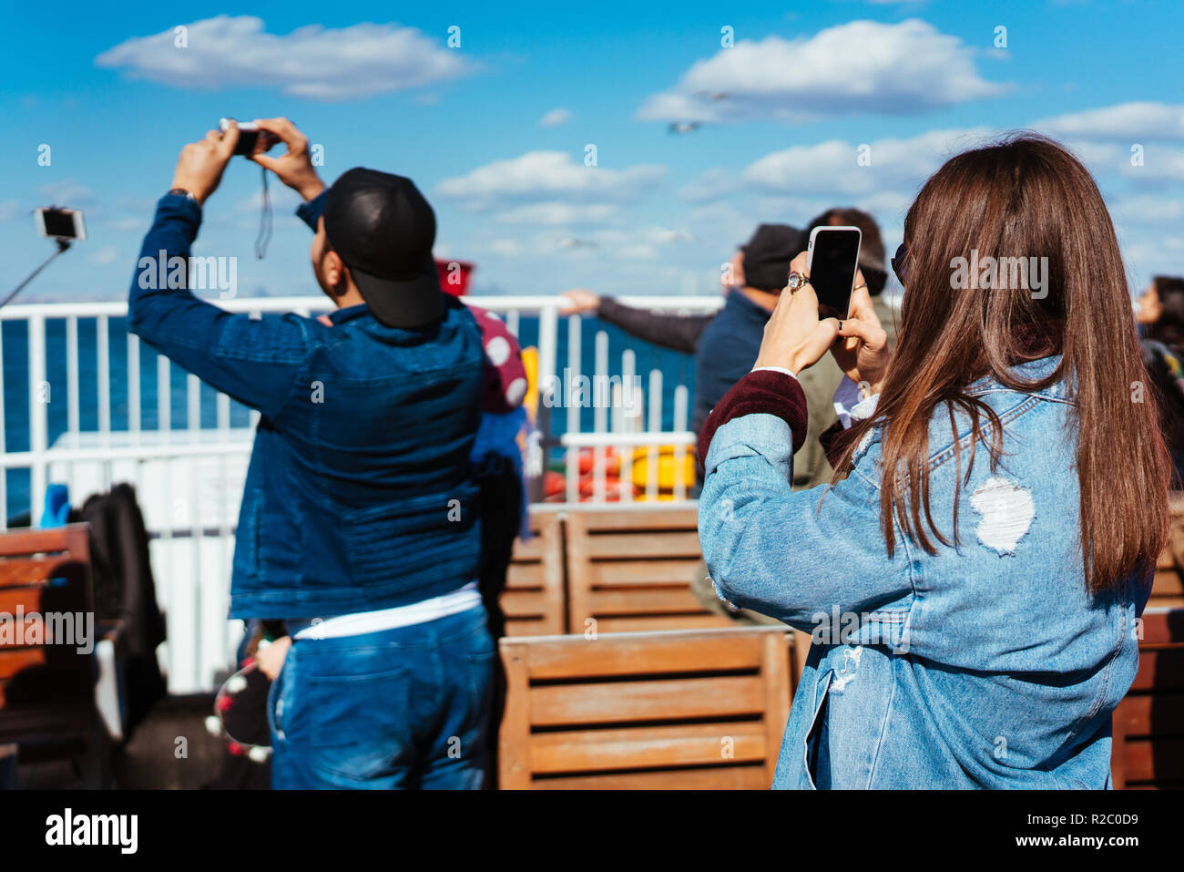Man and woman take pictures of birds Stock Photo - Alamy