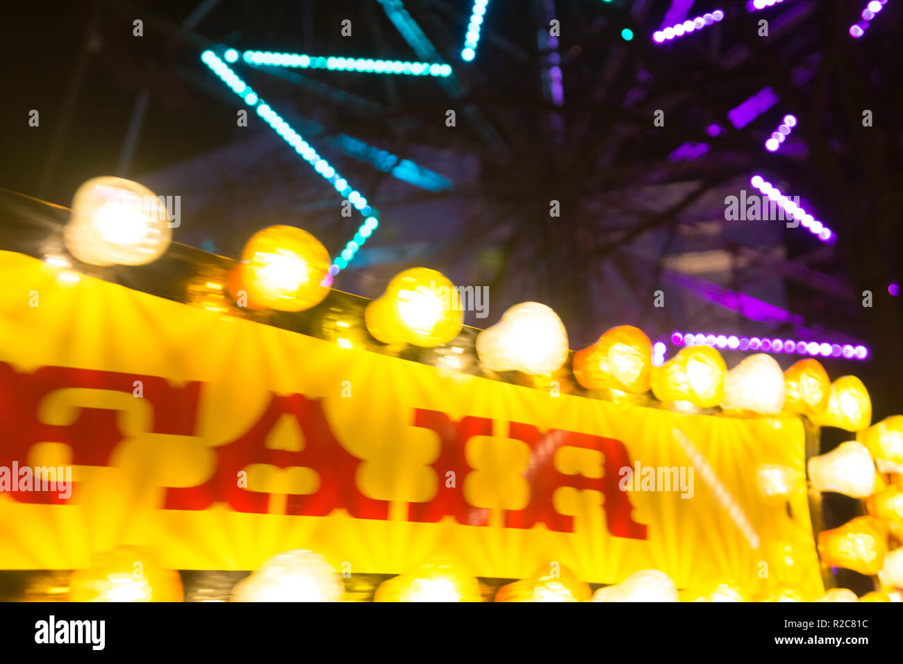 Fun fair lights, blurred for fairground background Stock Photo - Alamy