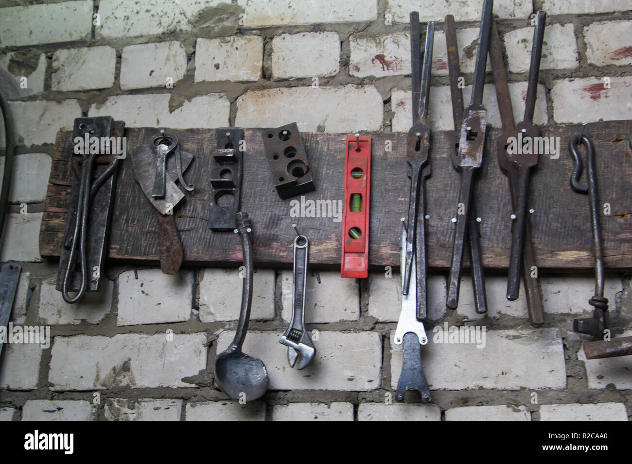 Workspace of blacksmith. Some tools on the wall. Close up shot Stock Photo - Alamy