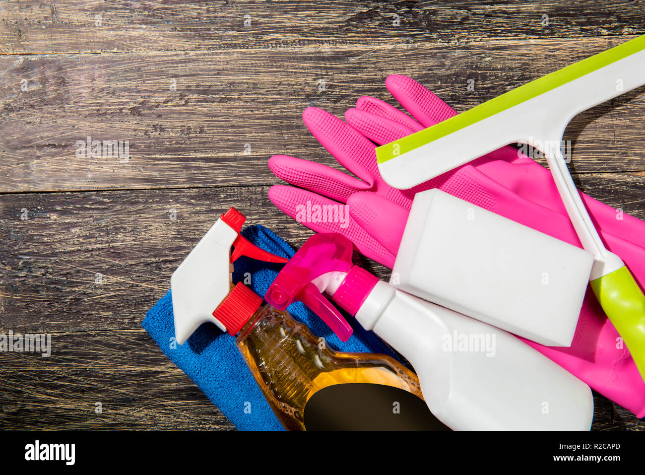 Products and cleaning tools on wooden background Stock Photo - Alamy