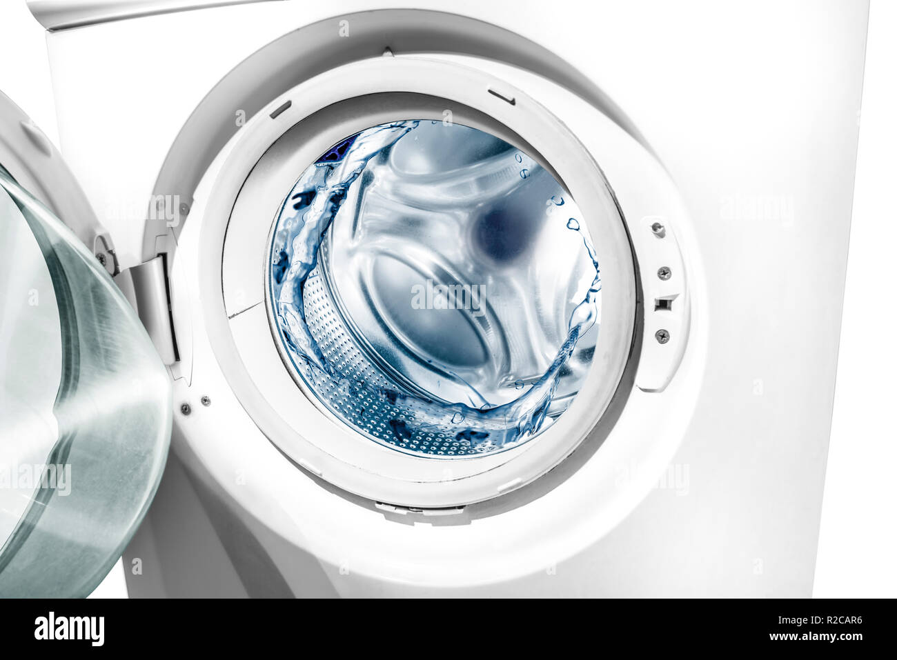 Water splashes in washing machine drum over white background Stock ...