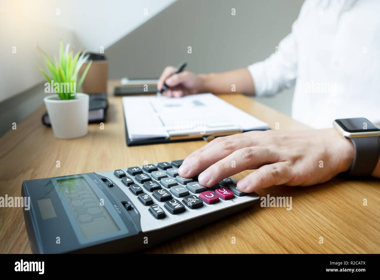Close-up Of Businessman Calculating data Invoices Analysis Using ...